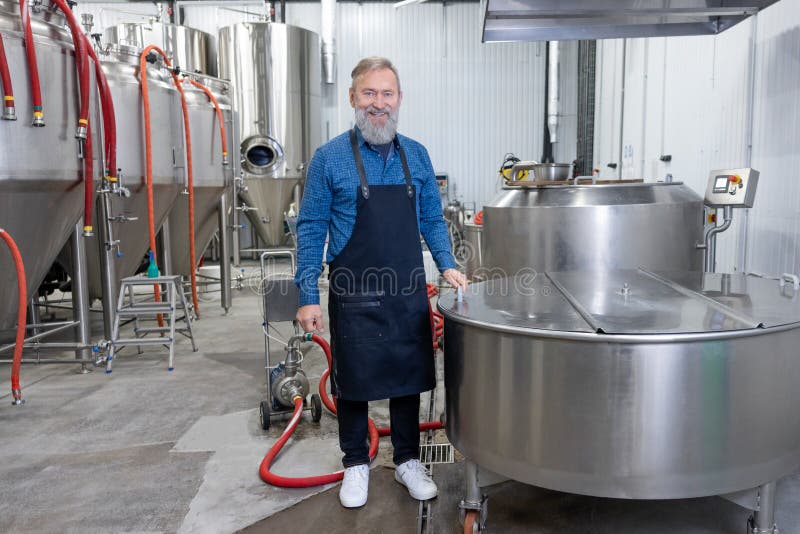 Factory Worker Standing Near the Tank with Beer Stock Photo - Image of ...
