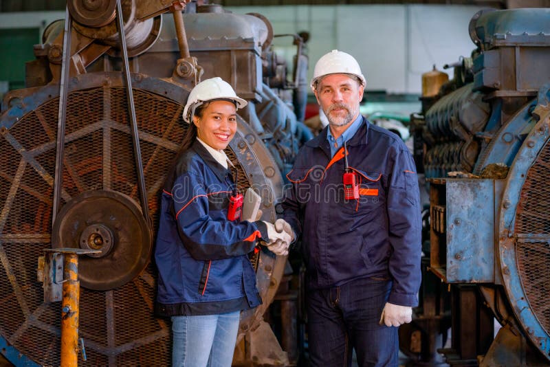 Factory Worker or Technician Stand and Shake Hands with Asian Factory ...