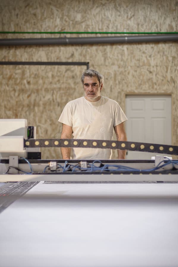 Technician Works on CNC Digital Cutter Machine for Cutting Textile ...