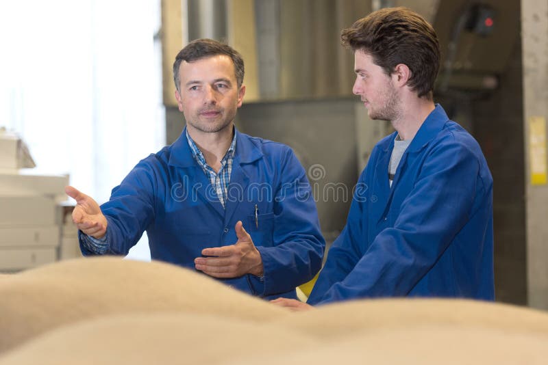 Factory Worker and Trainee in Store Room with Components Stock Image ...
