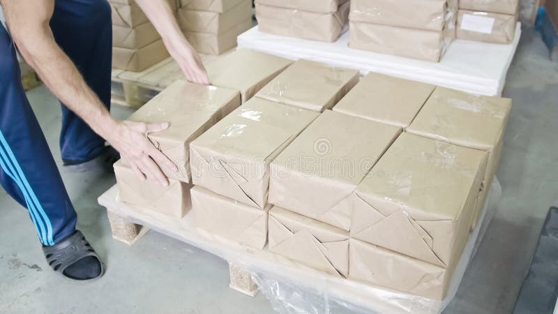 Factory Worker on Warehouse Packing Boxes for Delivery Stock Image ...