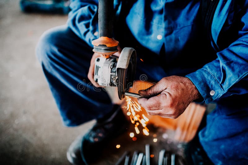 Factory Worker Working and Cutting Steel Iron with Angle Grinder Stock ...
