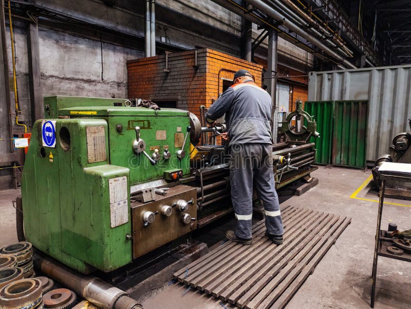 Factory Worker Working on Lathe Editorial Photo - Image of device ...