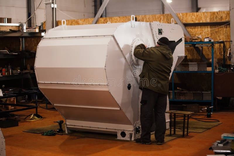 Factory Workers Assembling Industrial Equipment in Workshop Stock Image ...