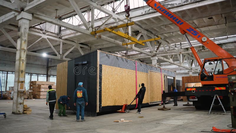 Workers Moving Prefabricated Modular House in Factory. Ternopil ...