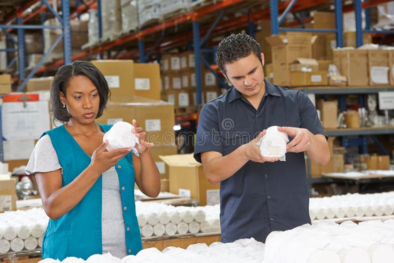 Factory Workers Checking Goods on Production Line Stock Image - Image ...