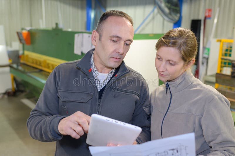 Factory Workers Checking Tablet Stock Photo - Image of tablet, equality ...