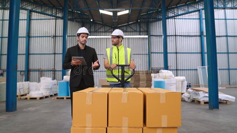 Factory Workers Deliver Boxes Package on a Pushing Trolley in the ...