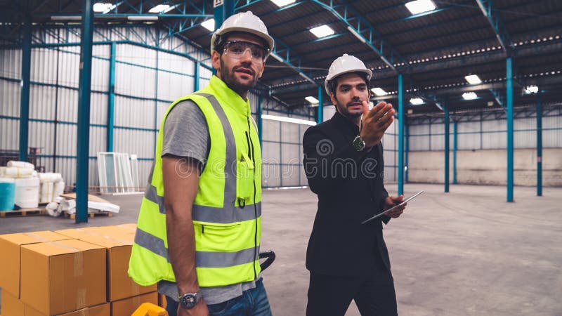 Factory Workers Deliver Boxes Package on a Pushing Trolley in the ...