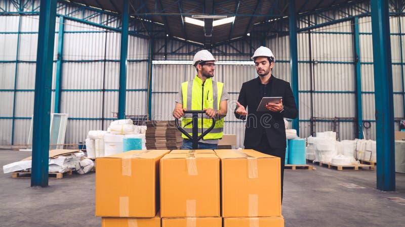 Factory Workers Deliver Boxes Package on a Pushing Trolley in the ...