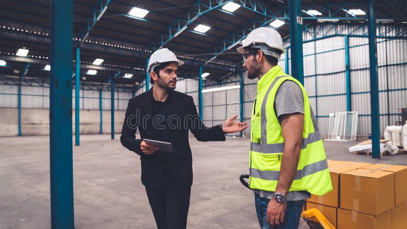 Factory Workers Deliver Boxes Package on a Pushing Trolley in the ...
