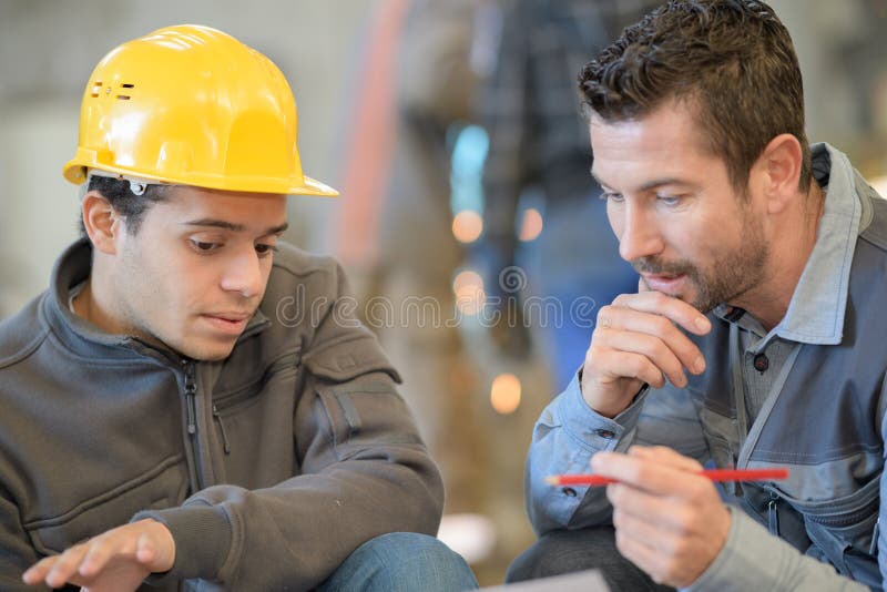Factory Workers Discussing Planning Stock Photo - Image of middle ...
