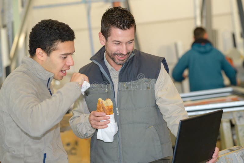 Factory Workers Eating Bread for Snack Stock Photo - Image of ...