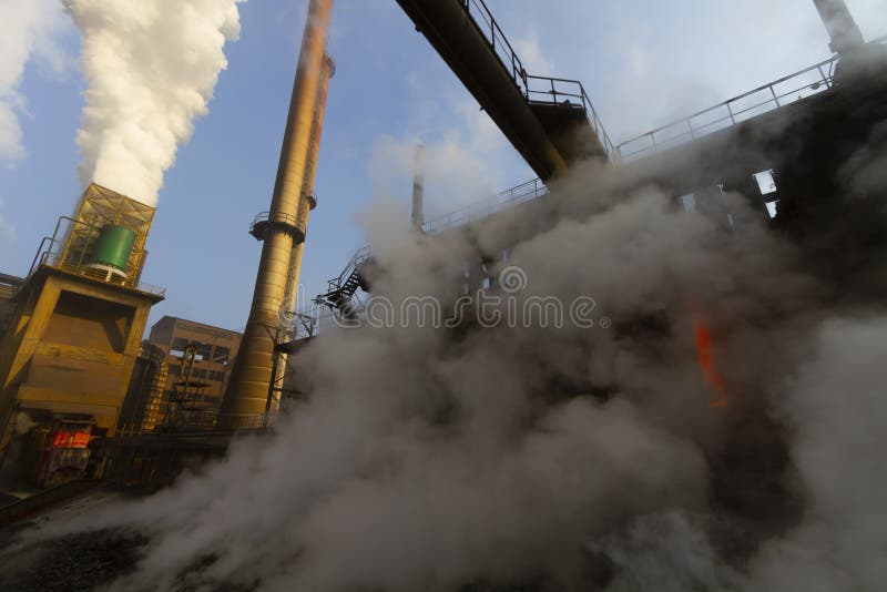 Iron and Steel Producing Factory and Workers Working. Stock Image ...