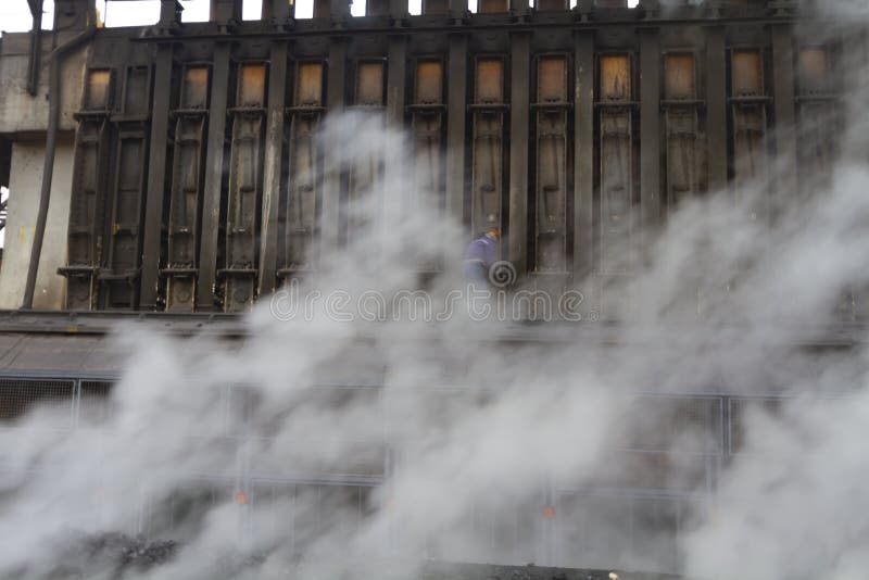 Iron and Steel Producing Factory and Workers Working. Stock Photo ...