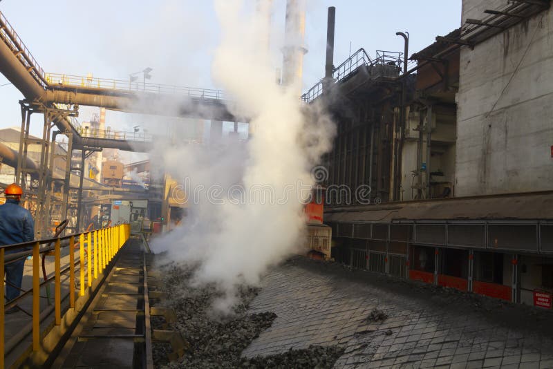 Iron and Steel Producing Factory and Workers Working. Stock Photo ...
