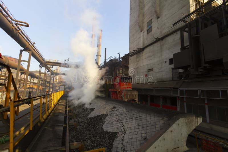 Iron and Steel Producing Factory and Workers Working. Stock Image ...