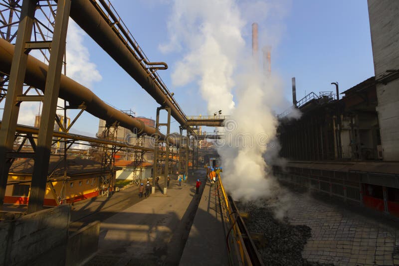 Iron and Steel Producing Factory and Workers Working. Stock Image ...