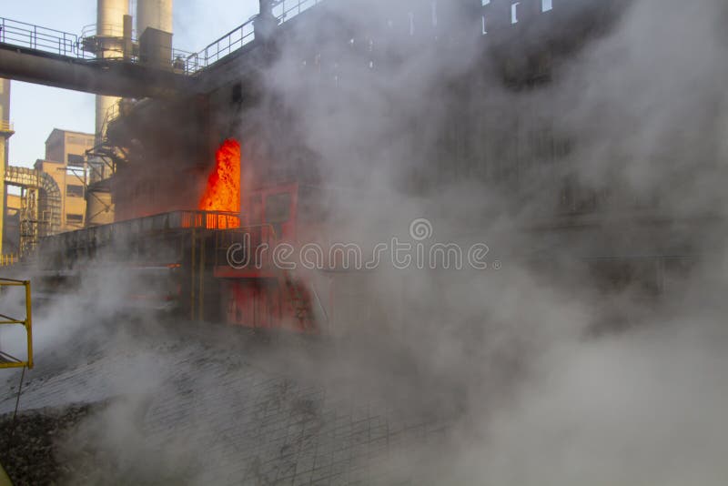 Iron and Steel Producing Factory and Workers Working. Stock Photo ...