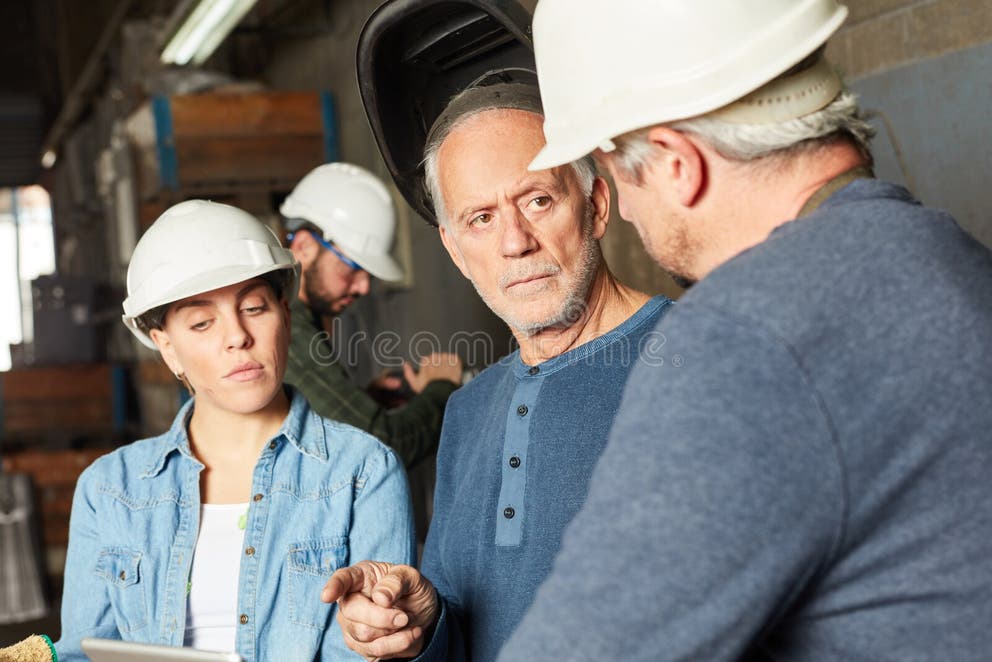 Factory Workers in a Meeting Stock Photo - Image of production, metal ...