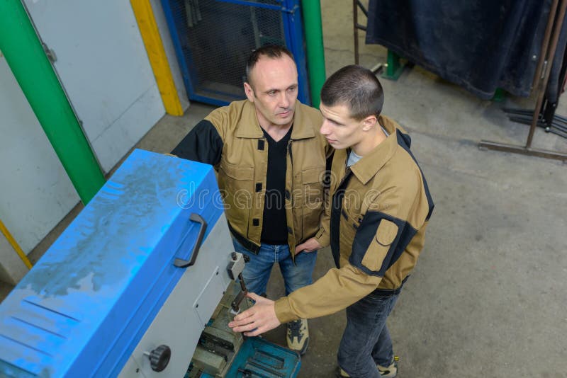 Factory Workers Outside Discussing Issues Stock Image - Image of danger ...