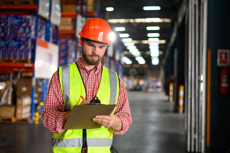 Factory Workers in Safety Uniforms Inspect and Check Inventory in ...