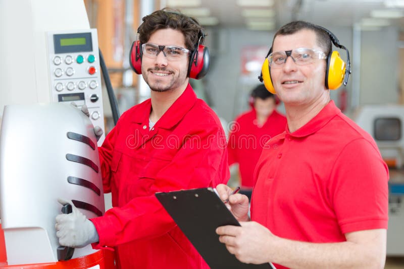Factory Workers Smiling Looking at Camera in Industrial Workshop Stock ...