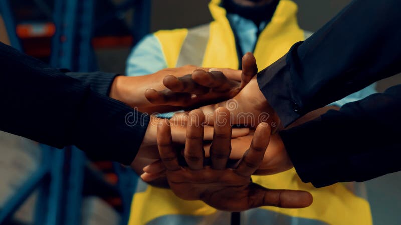 Factory Workers Stacking Hands Together in Warehouse or Storehouse ...