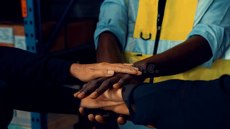 Factory Workers Stacking Hands Together in Warehouse or Storehouse ...