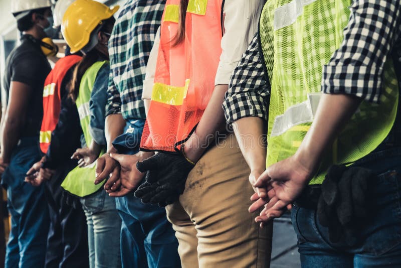 Factory Workers Standing in a Row Showing Teamwork and Unity Stock ...