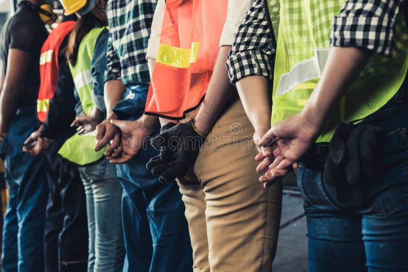 Factory Workers Standing in a Row Showing Teamwork and Unity Stock ...