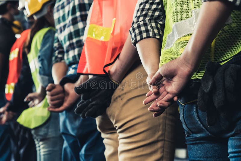 Factory Workers Standing in a Row Showing Teamwork and Unity. Stock ...