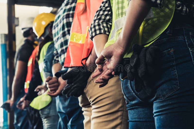 Factory Workers Standing in a Row Showing Teamwork and Unity. Stock ...