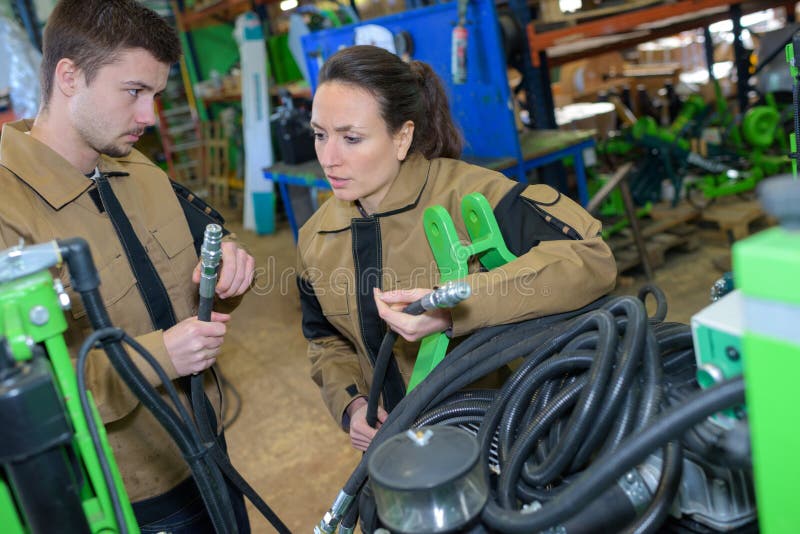 Factory Workers Talking in Warehouse Stock Image - Image of person ...