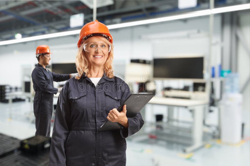 Factory Workers in Uniforms Stock Photo - Image of equipment, uniform ...