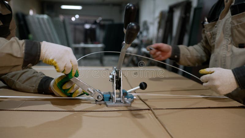 Workers Using Packing Tool for Securing Cardboard Box in Warehouse ...
