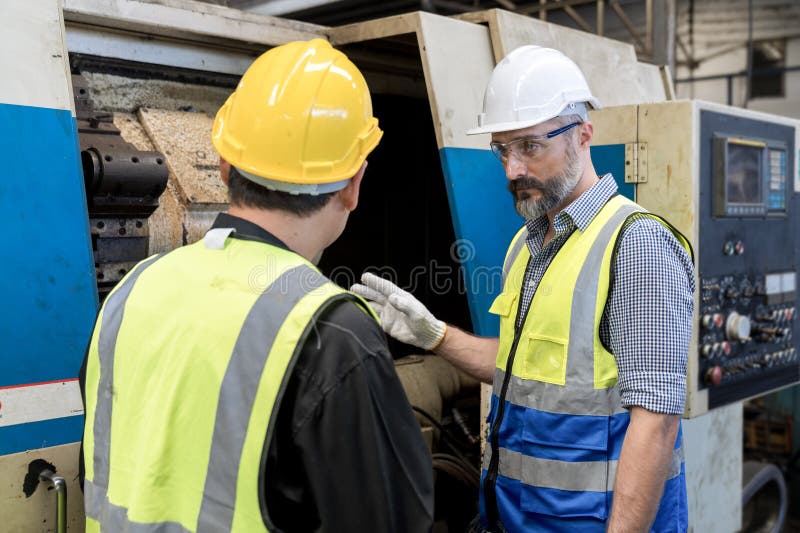 Team Workers and Workers are Standing in the Factory. Group Staff ...
