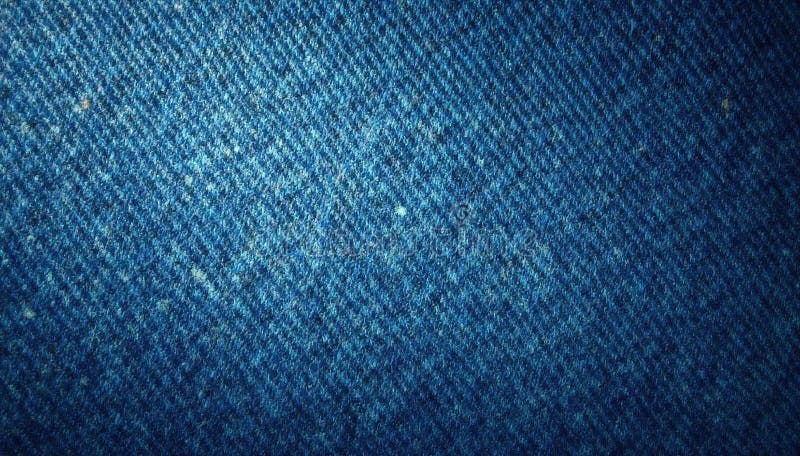 Faded Blue, Slightly Distressed Denim with Visible Stitching ...