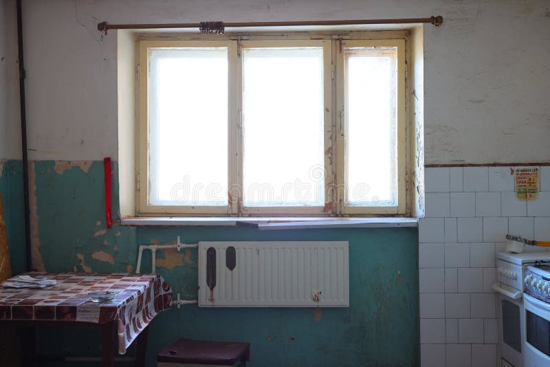 A Faded Kitchen that Features a Window and is Enhanced with Rustic ...
