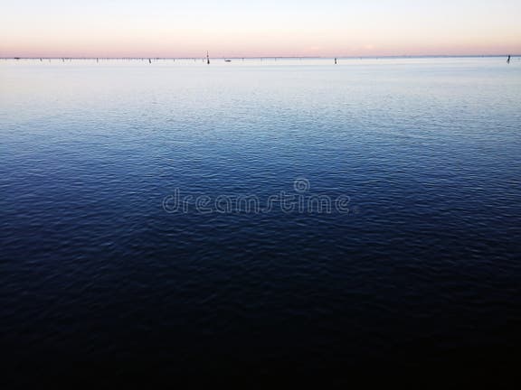 Faded ocean sunset stock image. Image of blue, shadow - 123904577
