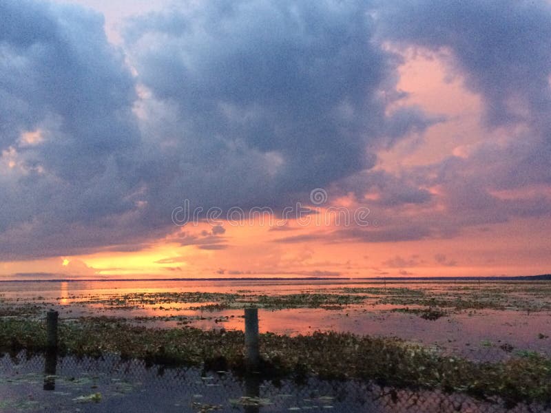 Fading Away stock image. Image of fades, sunset, lake - 95470579