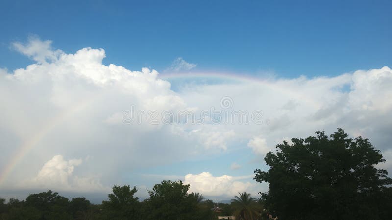 A Faint Rainbow Appears in the Sky after a Storm Stock Illustration ...
