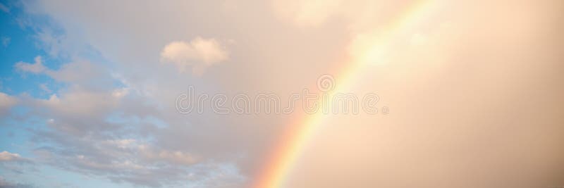 A Faint Rainbow Arc is Seen Against a Backdrop of Soft, Light-grey and ...