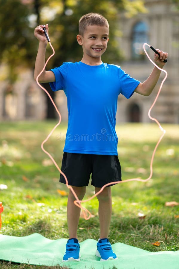 Fair-haired Boy with a Jumping Rope in Hands Stock Photo - Image of ...