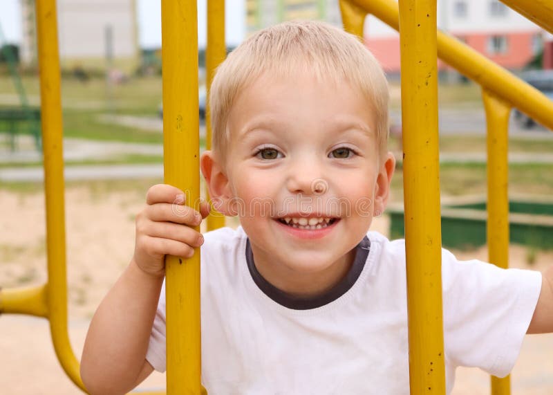 Fair-haired Boy on the Playground Smiling Looking at the Camera Stock ...