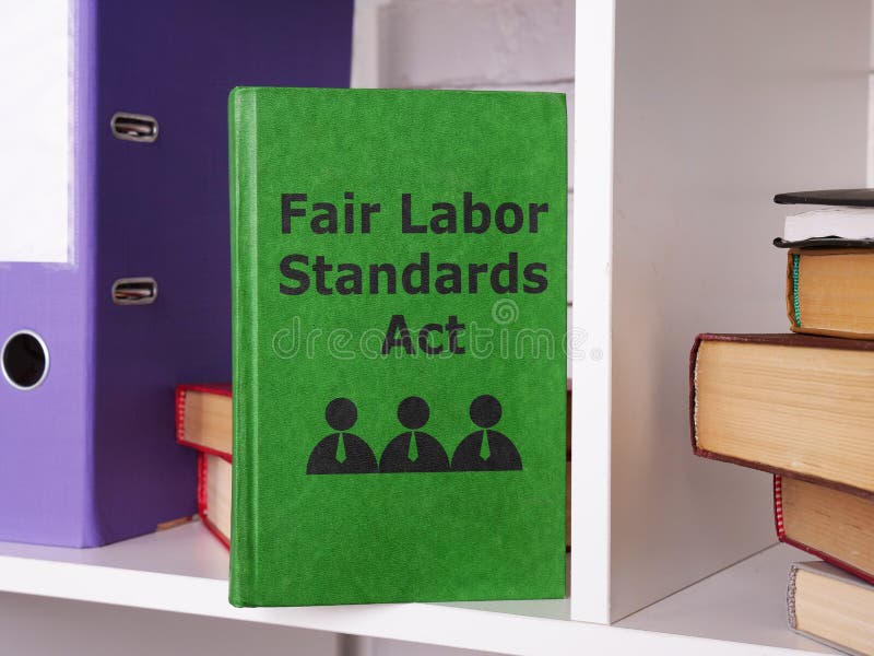 Fair Labor Standards Act FLSA is Shown Using a Text on the Book Stock ...