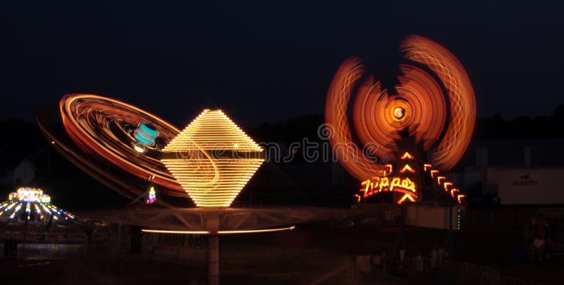 Fair rides at night stock image. Image of light, spin - 42139699