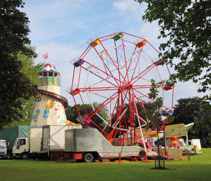 Fairground with Ferris Wheel Stock Photo - Image of trucks, skelter ...