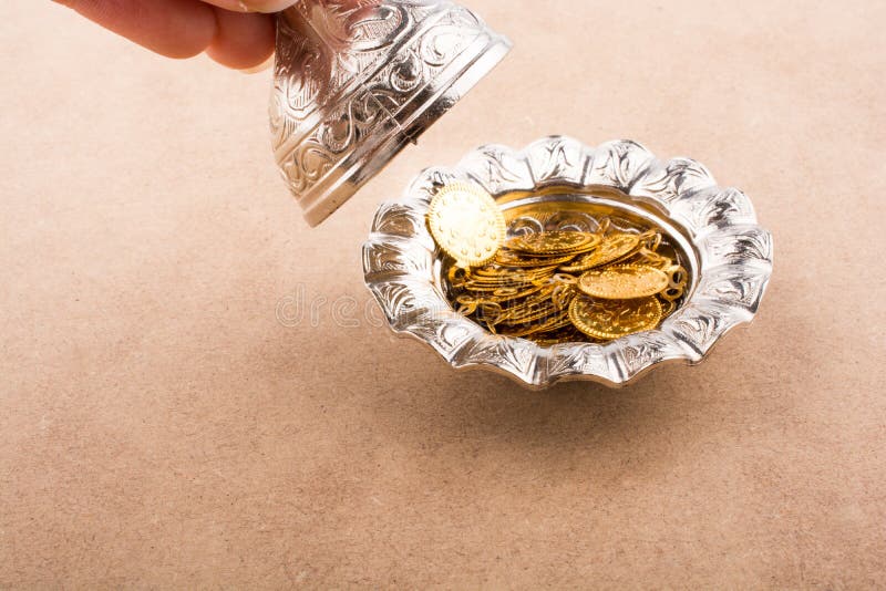 Fake Gold Coins in a Metal Plate Stock Photo - Image of coins, finance ...