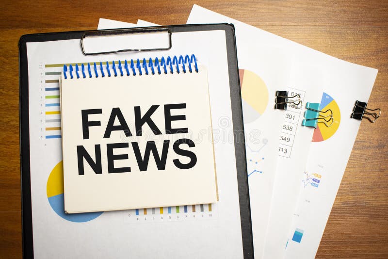FAKE NEWS Words on a Small Red Piece of Paper Stock Photo - Image of ...